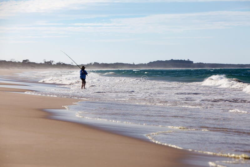 Surf Cast Fishing on an Ocean Beach Stock Photo - Image of waves, ocean ...