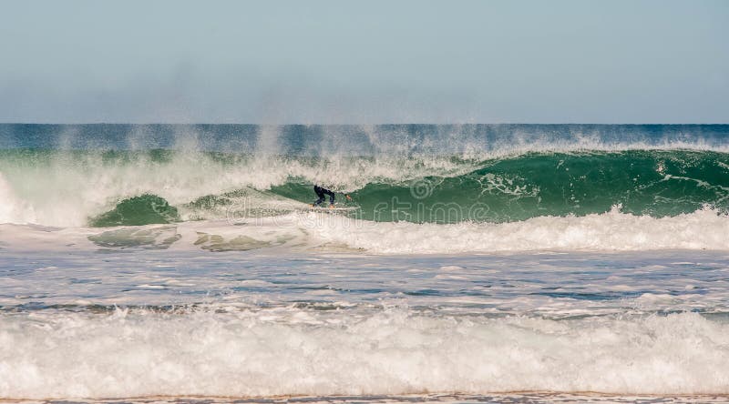 Surfer in a Barrel Falling Under the Force of the Waves Stock Photo ...