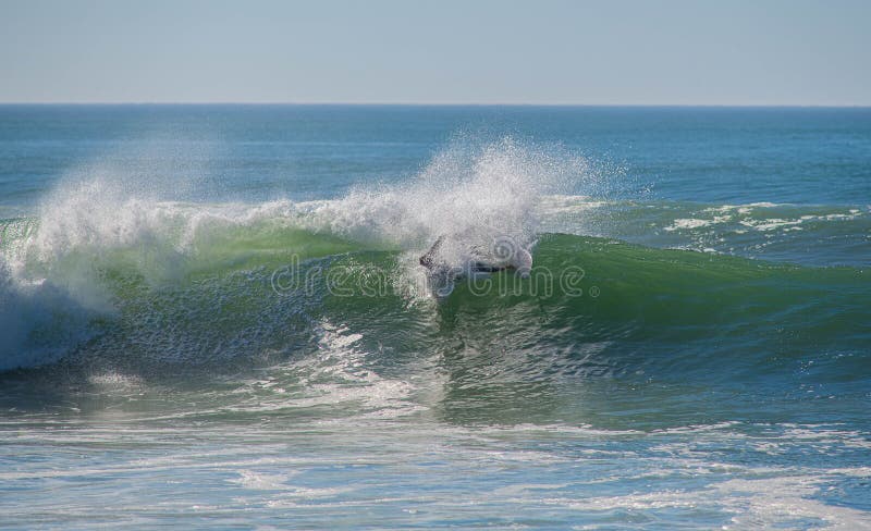 Surfer in a Barrel Falling Under the Force of the Waves Stock Photo ...