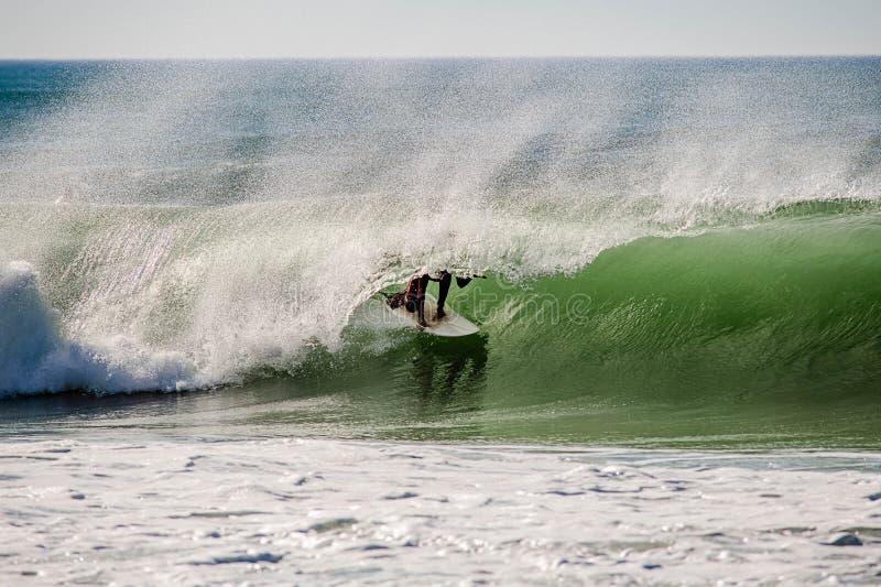 Surfer in a Barrel Falling Under the Force of the Waves Stock Image ...