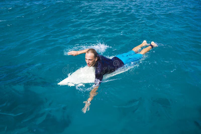 Surfer in Amazing Blue Water Stock Photo - Image of male, pacific: 55209818