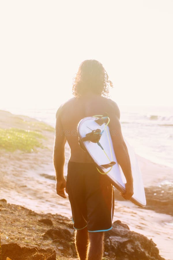 Surfer from the Back in the Rays of Dawn Stock Photo - Image of ...