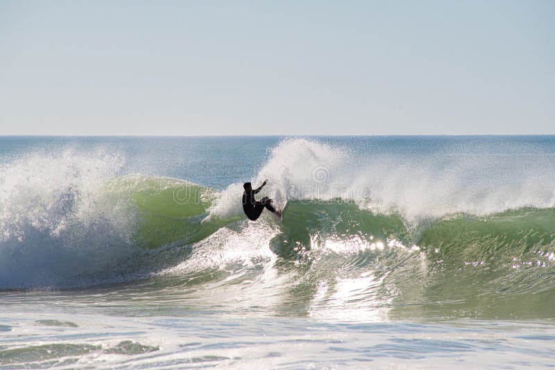 Surfer in a Barrel Falling Under the Force of the Waves Stock Image ...
