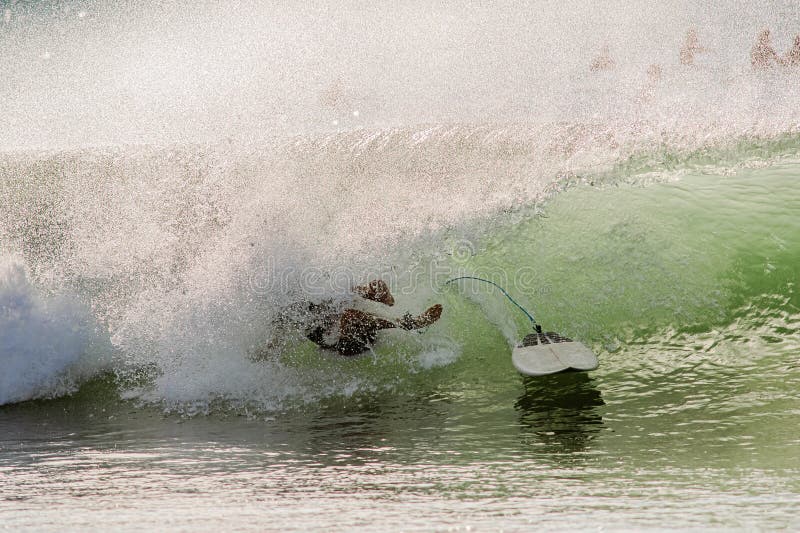 Surfer in a Barrel Falling Under the Force of the Waves Stock Image ...