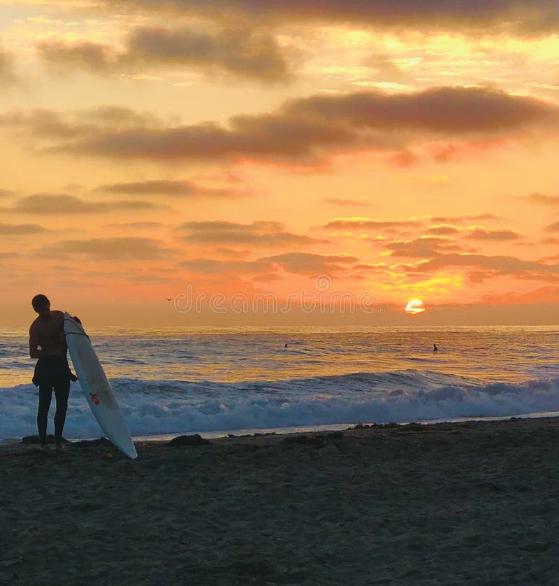 Surfer on the beach editorial photo. Image of beach - 149577106
