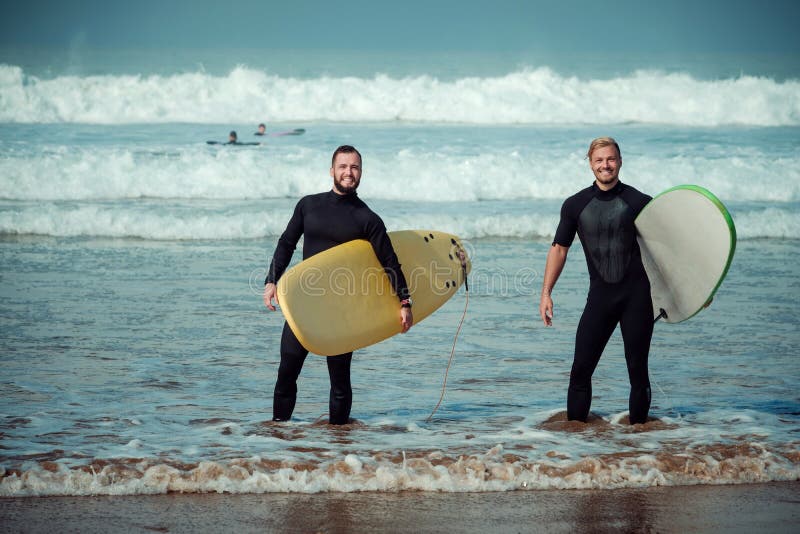 Surfer Beginner and Instructor on a Beach with a Surfboards Stock Photo ...