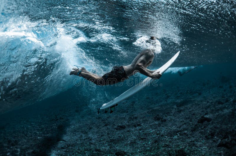 Surfer dives stock image. Image of reef, clean, surfing - 168827143