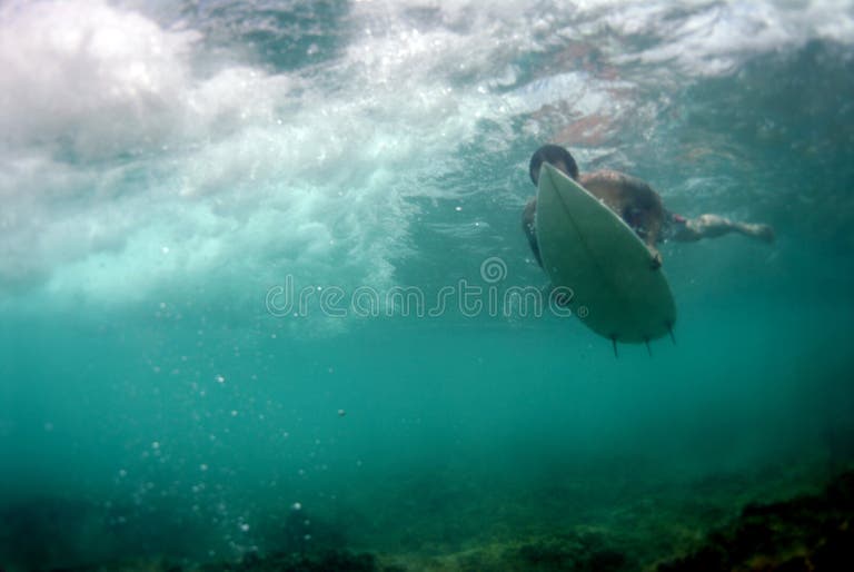 Surfer Duckdiving stock image. Image of gnarly, ride, surf - 2591775