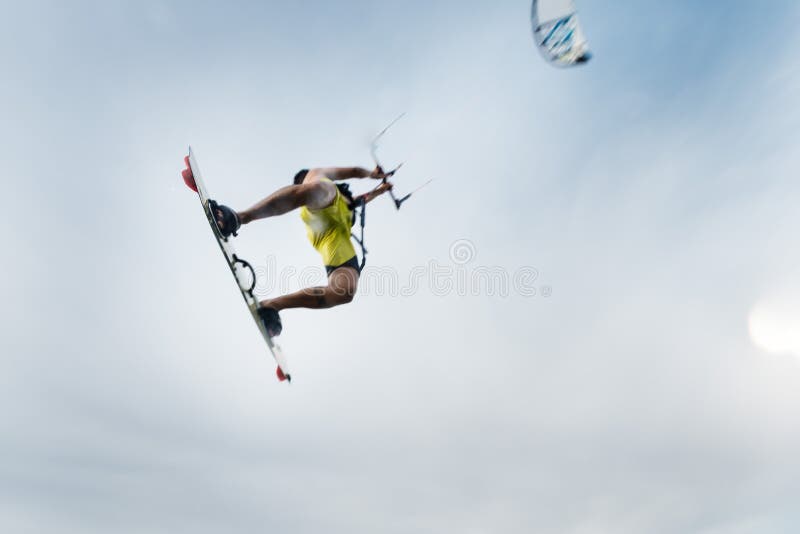Surfer Flying with His Kite Stock Photo - Image of surfer, adrenaline ...