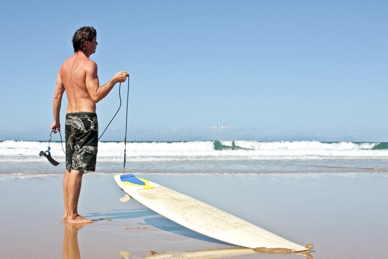 Surfer with His Surfboard at the Beach Stock Photo - Image of outdoor ...