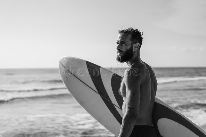 Surfer Holding His Surfboard On The Beach Hipster Man Standing On The