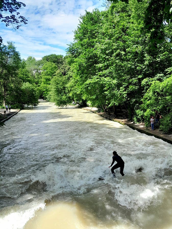 Surfer on the Eisbach River in the English Garden, in Munich, Germany ...