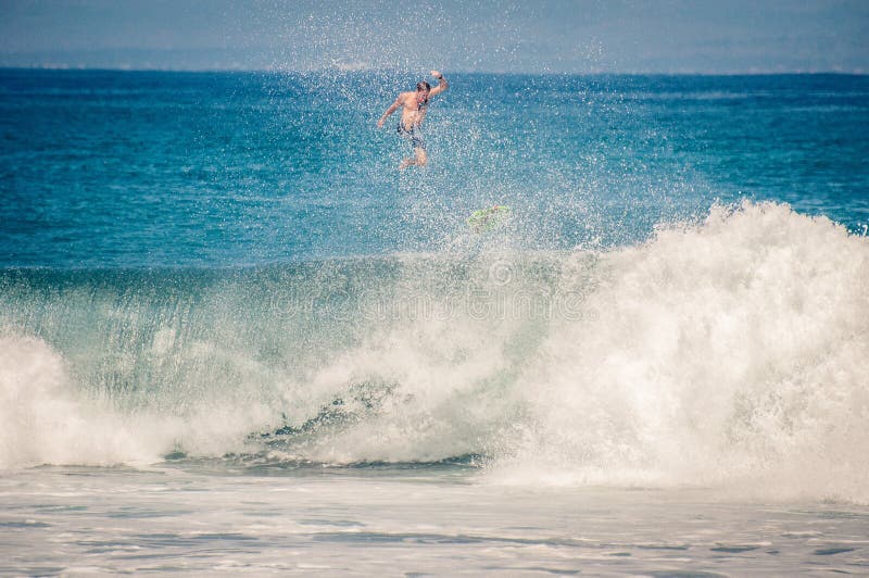 Surfer Jumps A Powerful And Big Wave At Sunset Stock Image - Image of ...