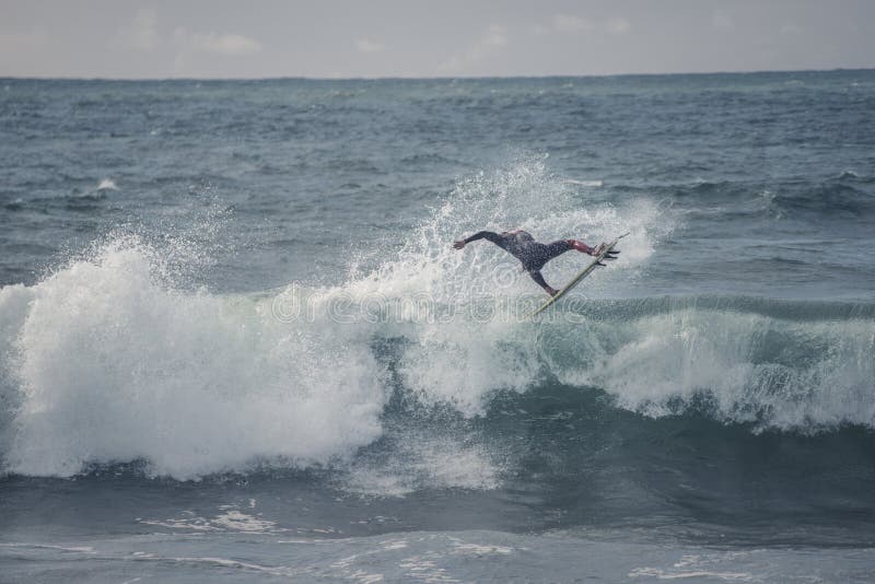 Surfer performs dive stock image. Image of foam, male - 144119023