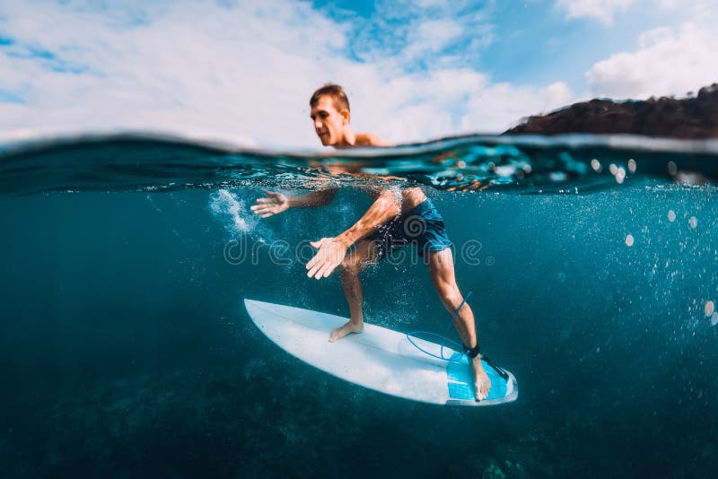 Surfer Man Relaxing with Surfboard in Ocean Stock Photo - Image of dive ...