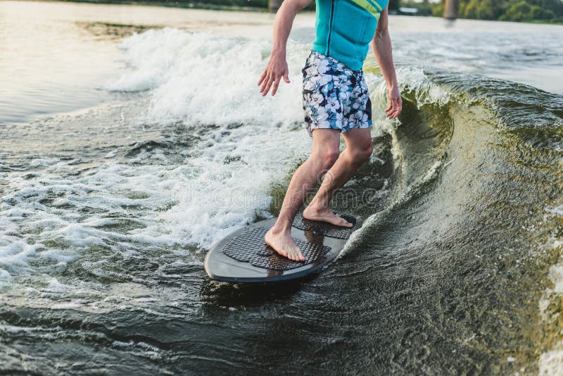 Surfer rides on the board stock photo. Image of athletics - 131097422