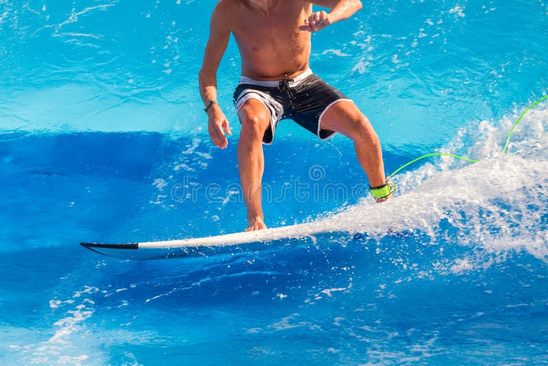 Surfer riding the waves stock image. Image of muscles - 142055865