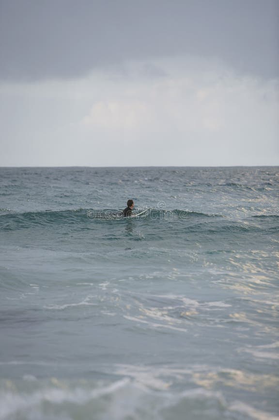 Surfer Sitting on Surfboard in Sea Side View Editorial Photography ...