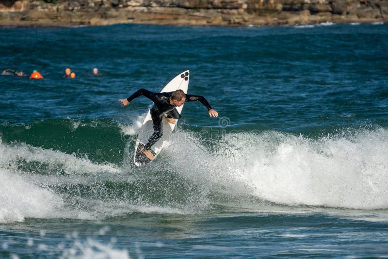 Surfer Standing on the Shortboard and Catching Waves, and almost ...