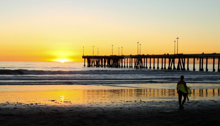 Surfer at sunset stock photo. Image of surfer, sunset - 22677676