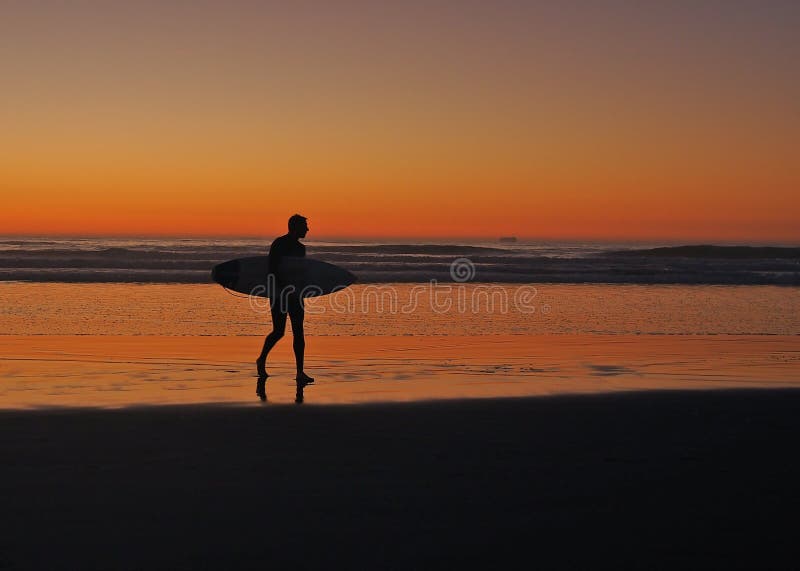 Surfer at sunset stock photo. Image of glow, beach, recreation - 27634340