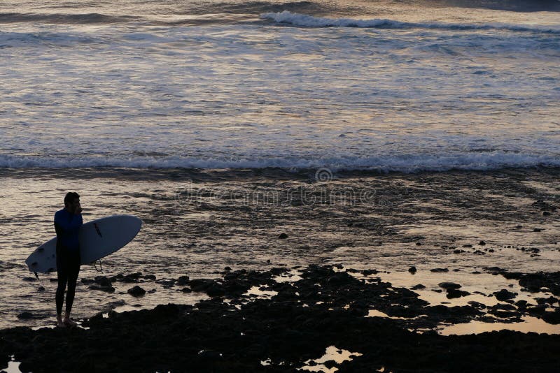 Surfer at Sunset on a Calm Ocean Editorial Photography - Image of ...