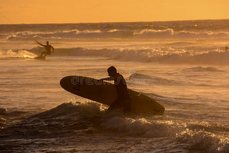 Surfer at Sunset on a Calm Ocean Editorial Photography - Image of ...