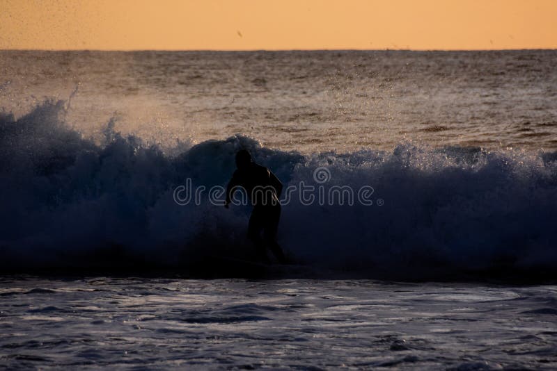 Surfer at Sunset on a Calm Ocean Stock Image - Image of silhouette ...