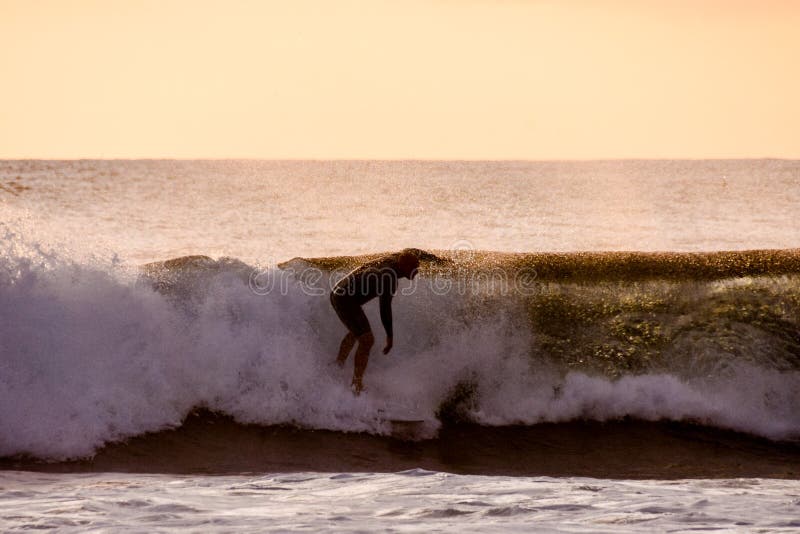 Surfer at Sunset on a Calm Ocean Editorial Stock Image - Image of ...