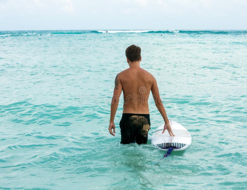 Surfer with Surfboard in Ocean Stock Photo - Image of signs, drops ...