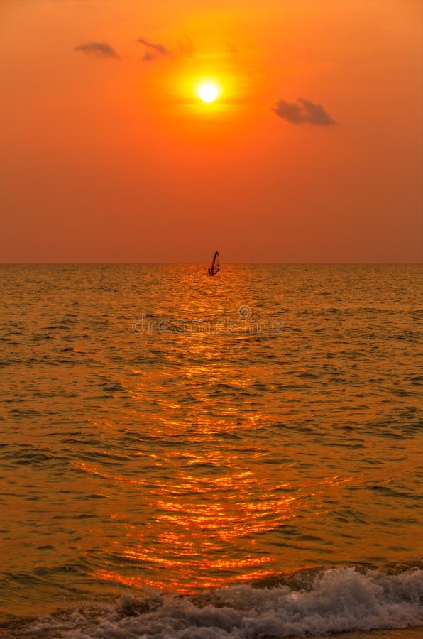 Surfer Surfing Alone in Sea at Sunset Stock Image - Image of sport ...