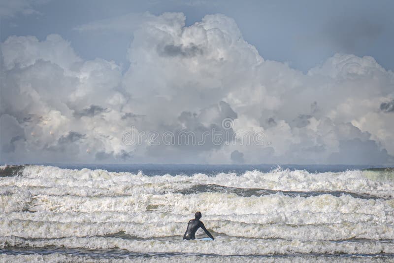 A Surfer Surfing in the Ocean in Rough Waves Stock Image - Image of ...