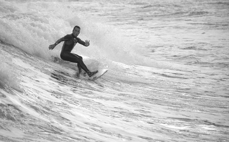 Surfer surfing in the sea editorial stock image. Image of making - 53084304