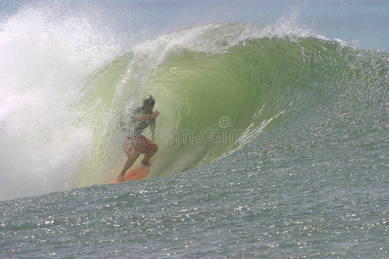 Surfer Surfing on a White Surfboard Stock Image - Image of surfers ...
