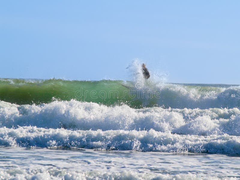 Surfer Surrounded by Splashing Water while Riding Surf Stock Photo ...