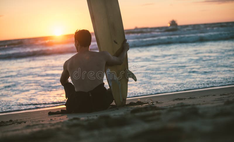 Surfer Taking a Break on the Beach Stock Photo - Image of environment ...