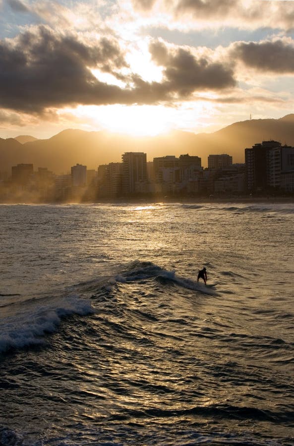 Surfer under Sunset stock photo. Image of beach, surf - 3563308