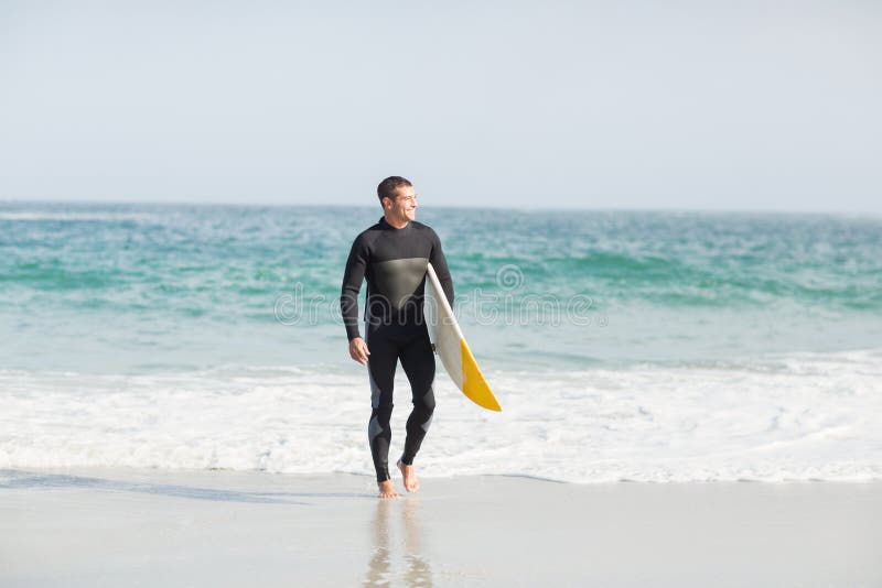 Surfer Walking on the Beach with a Surfboard Stock Image - Image of ...