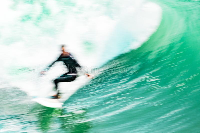 Surfer on wave in motion stock photo. Image of water - 97260492