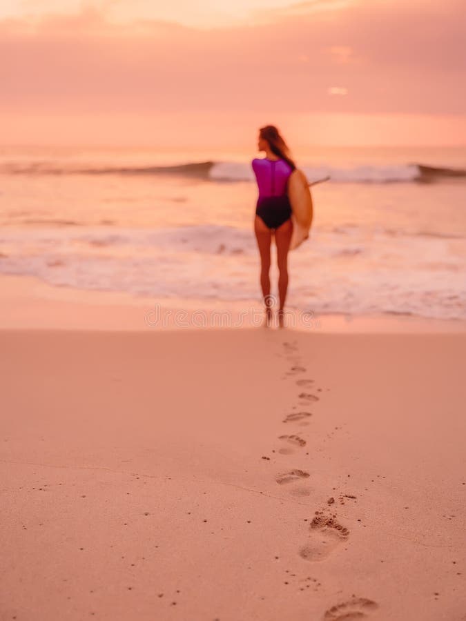 Beautiful Surfer Woman with Surfboard Posing on a Beach at Sunset Stock ...