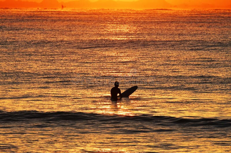 Surfers on the Beach at Dawn. Stock Photo - Image of beautiful, scenic ...