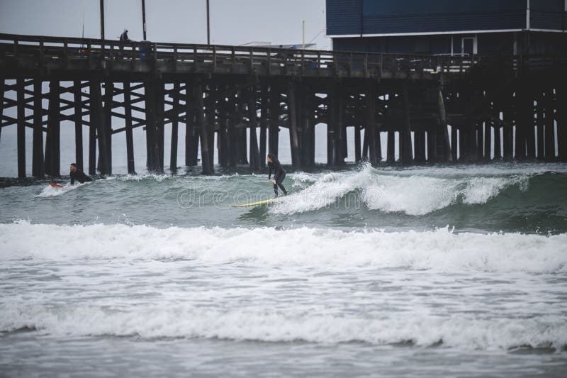 Surfers Hitting the Waves at Newport Beach, California Editorial Photo ...
