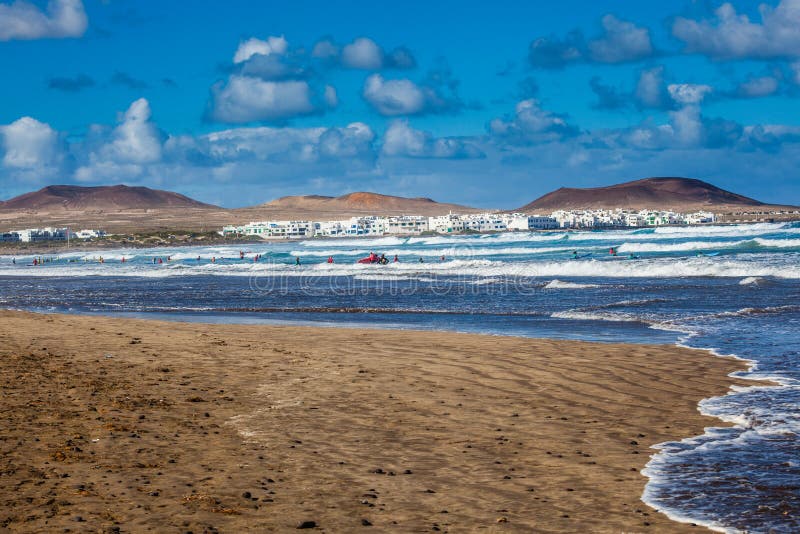 Surfers On The Beach Of Famara, Lanzarote, Canary Islands, Spain ...