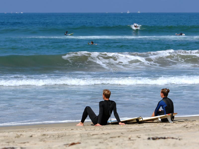 Surfers Take a Rest stock photo. Image of coast, water - 2734632