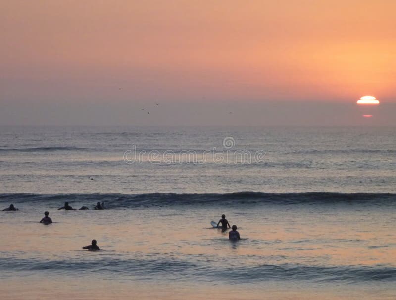 Surfers Waiting for a Wave in the Sunset Stock Image - Image of shore ...
