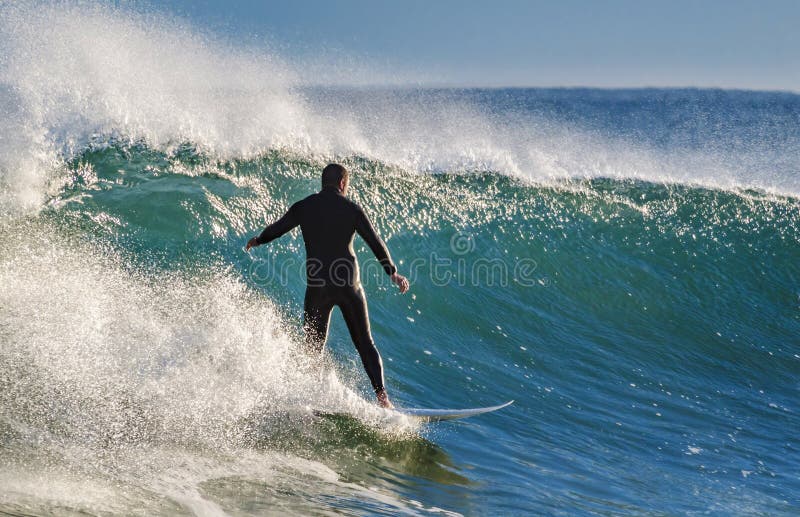 Surfer Wearing a Wetsuit Riding a Small Wave Editorial Stock Photo ...