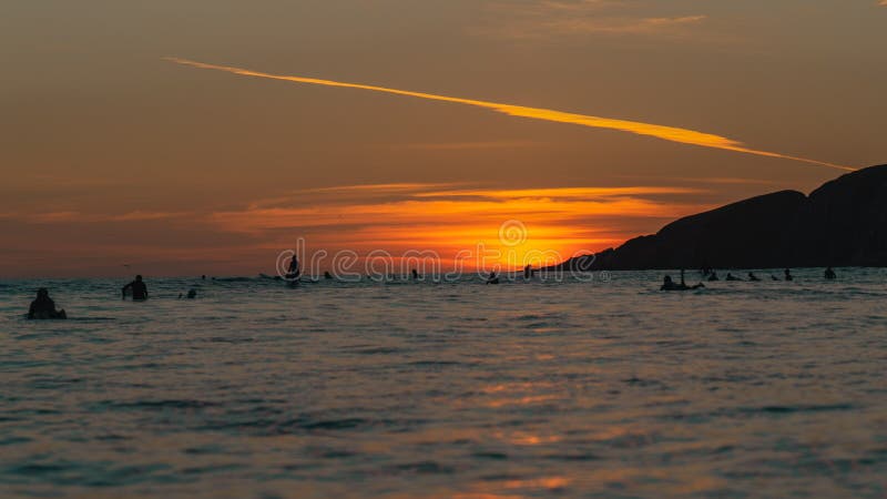 Surfing during the Beautiful Sunset Stock Image - Image of summer, dusk ...