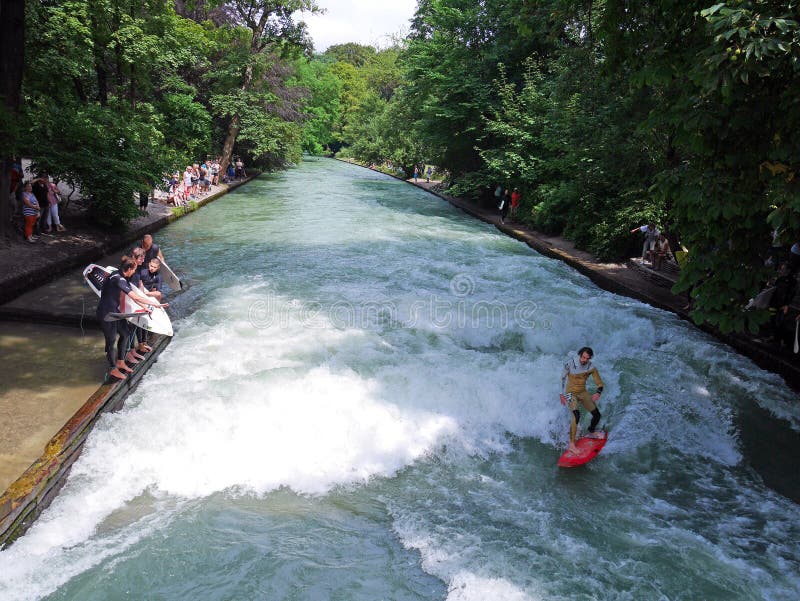 Surfing at Eisbach in Central Park, Munich, Germany Editorial ...