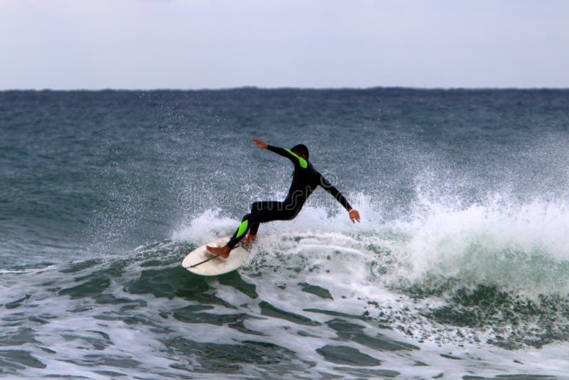 Surfing - Riding a Wave on Light Boards. Editorial Photography - Image ...