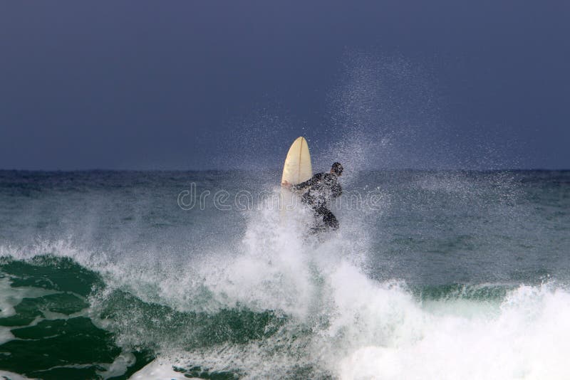 Surfing - Riding a Wave on Light Boards. Editorial Photography - Image ...